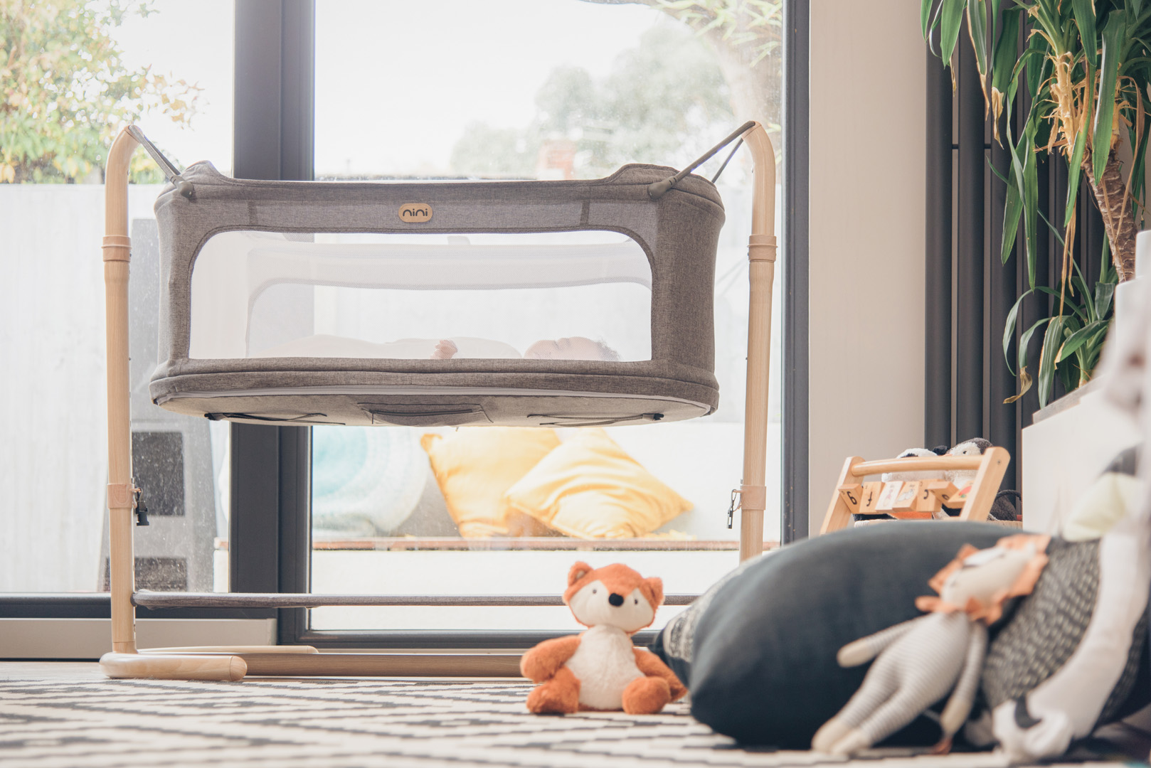 How a Swing Cot Can Help Your Baby Sleep Through the Night - Nini Baby